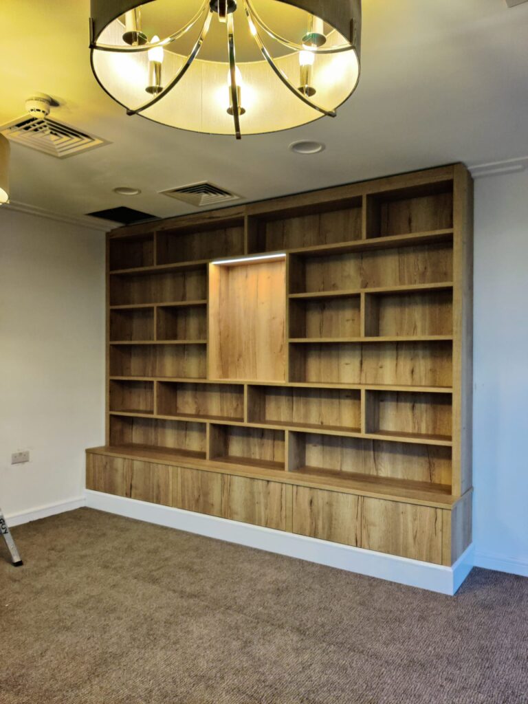 Manufacture and installation of bespoke fully fitted library cabinet at ...