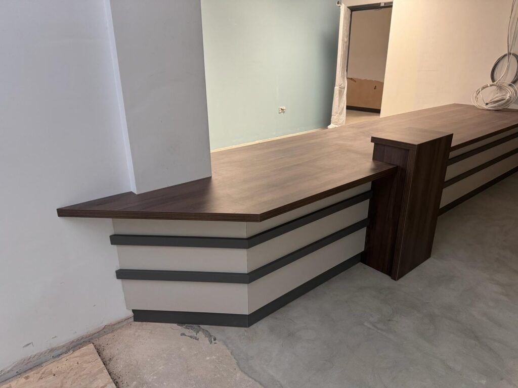 Sleek and modern reception desk manufactured and installed at ...